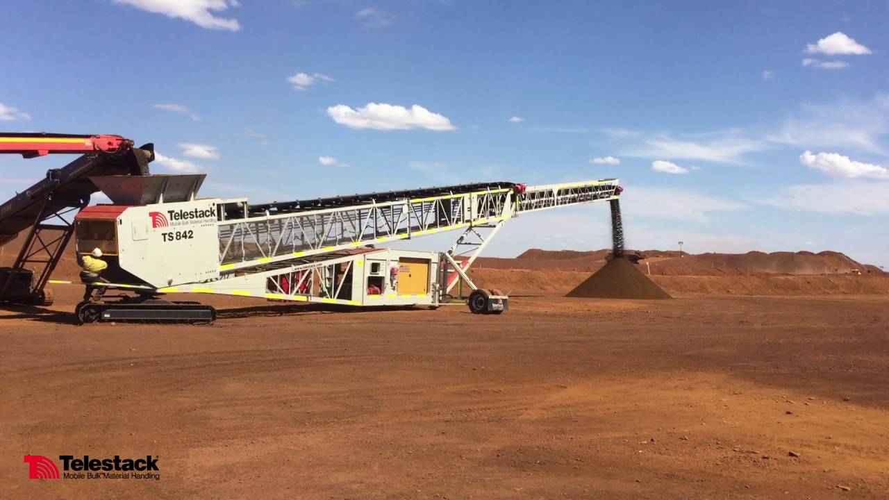 TS 842 Radial Telescopic Conveyor stockpiling iron ore - YouTube