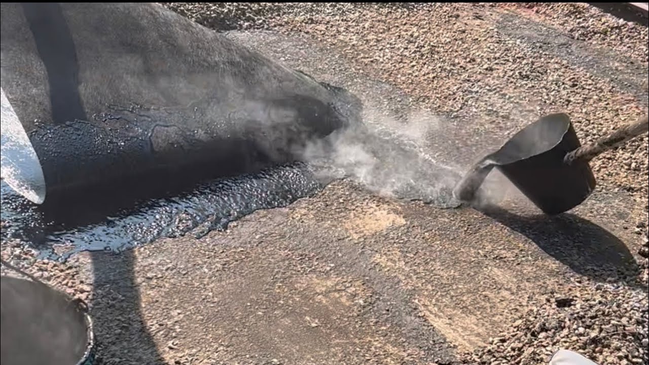 Pouring hot asphalt on roof repair - YouTube