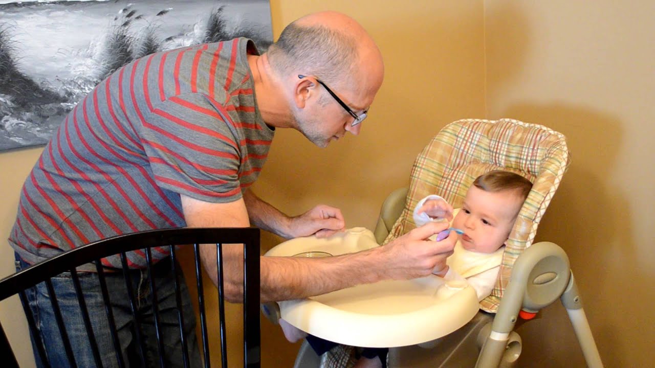 Daddy Attempting to Feeding Robbie Eating Rice Cereal - YouTube