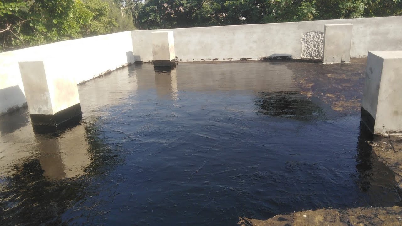 Applying of hot bitumen on roof for waterproofing agent 10/20 and 80/ ...