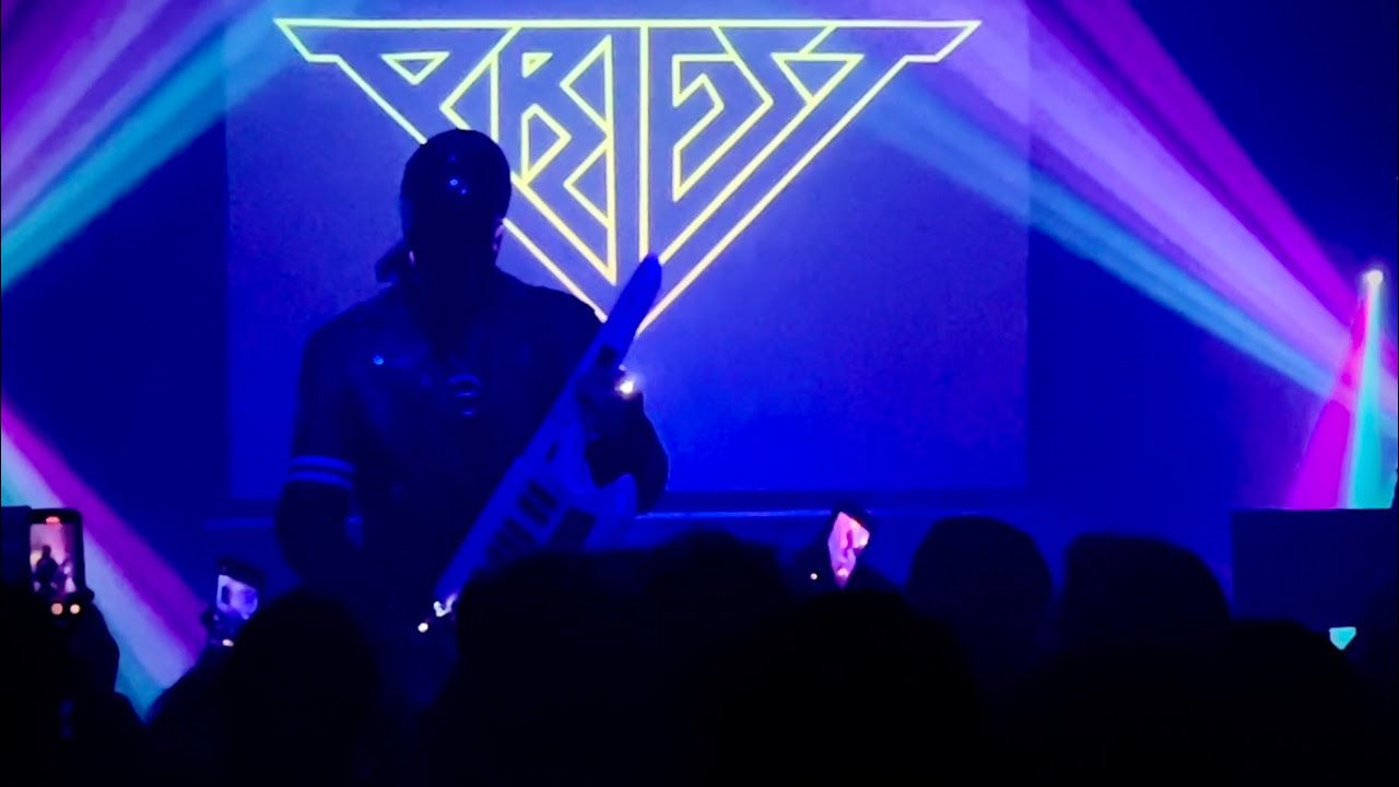 PRIEST’S Mercury communes with crowd during band member Salt’s keytar ...