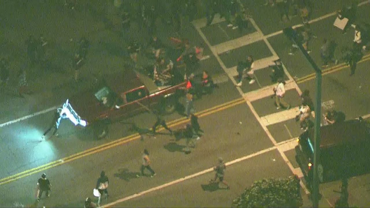 Protesters in Virginia Beach hitting a truck that has an American Flag ...