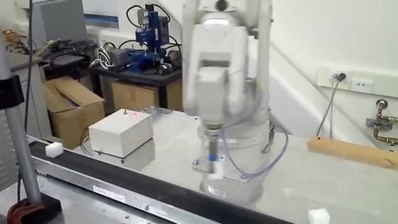 Adept Robot Assembly Line with Optics Demonstration - YouTube