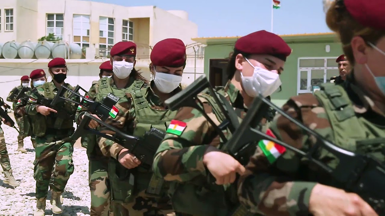 Peshmerga female soldiers run through squad movement drills at the ...