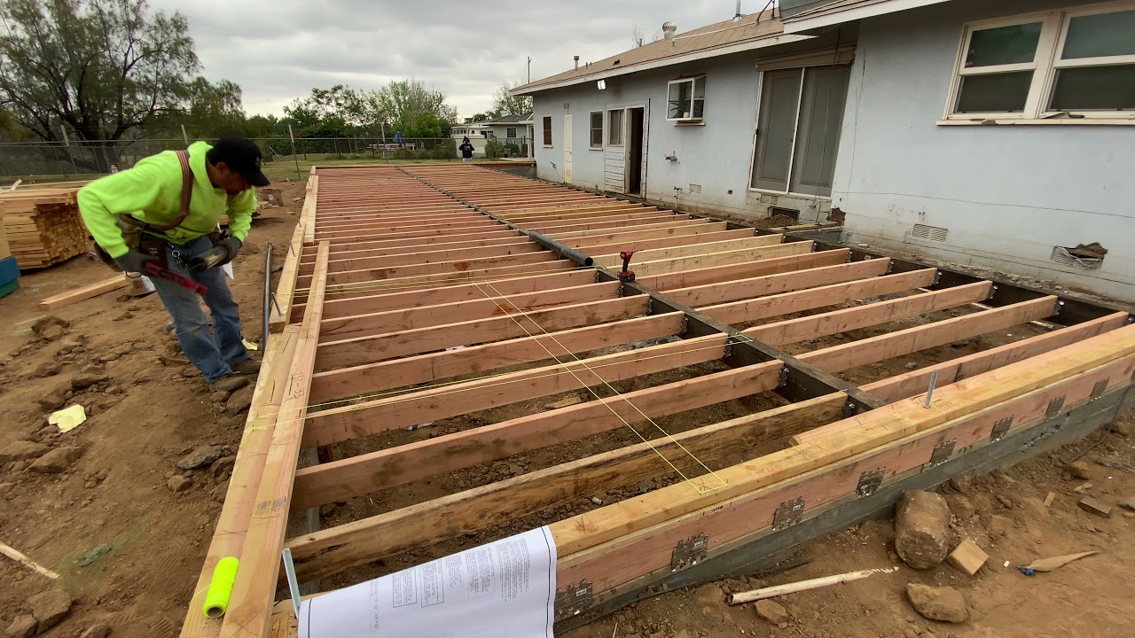 Framing ledger boards and girders and setting floor joists - YouTube