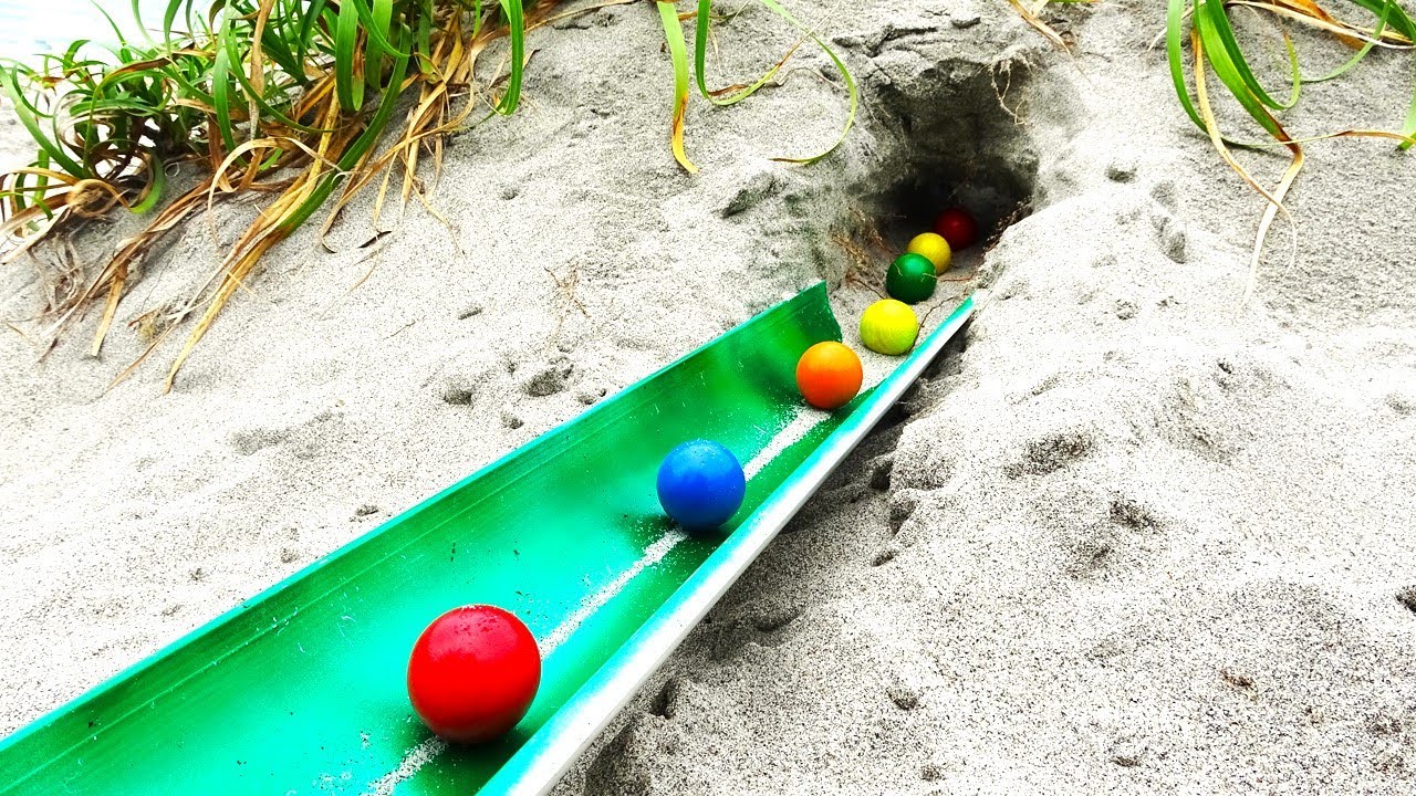 Marble run race ☆ rain gutter + big colorful ball + sandy beach course ...