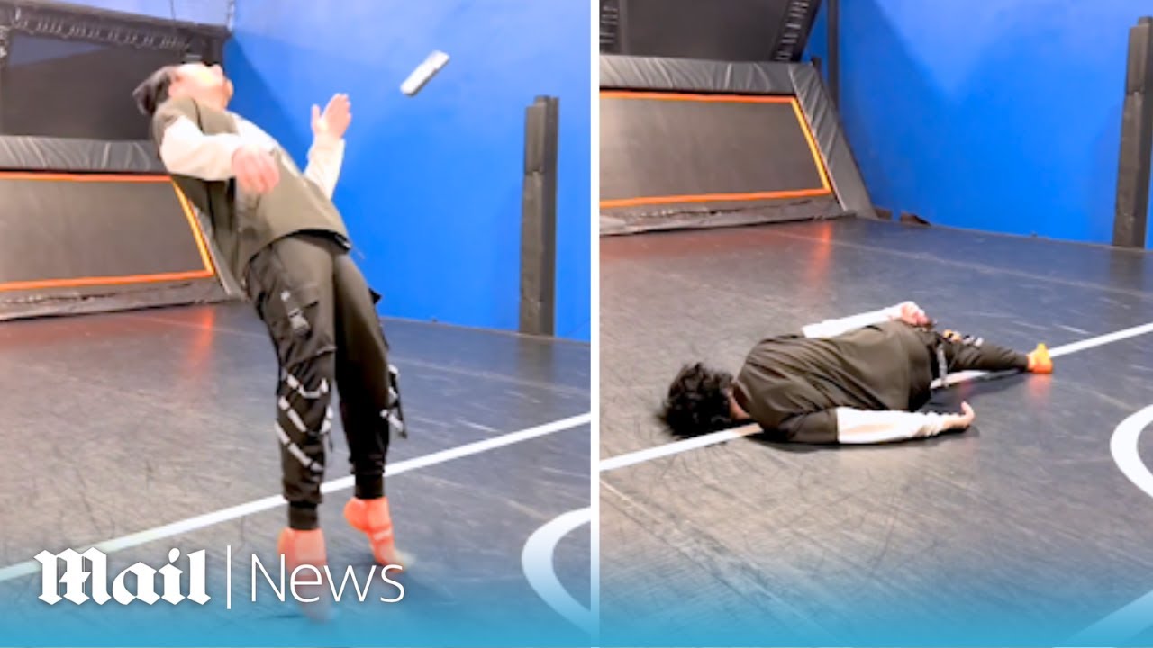 Stuntman practices getting shot in the head as he falls to the ground ...