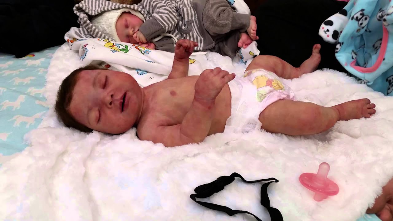 Changing Full Body Silicone Baby into Pajamas - YouTube