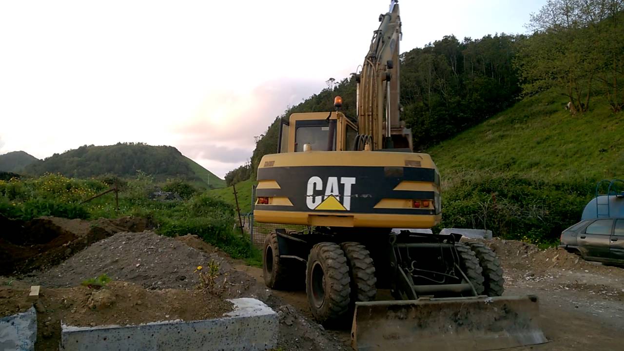 Caterpillar M312 - YouTube