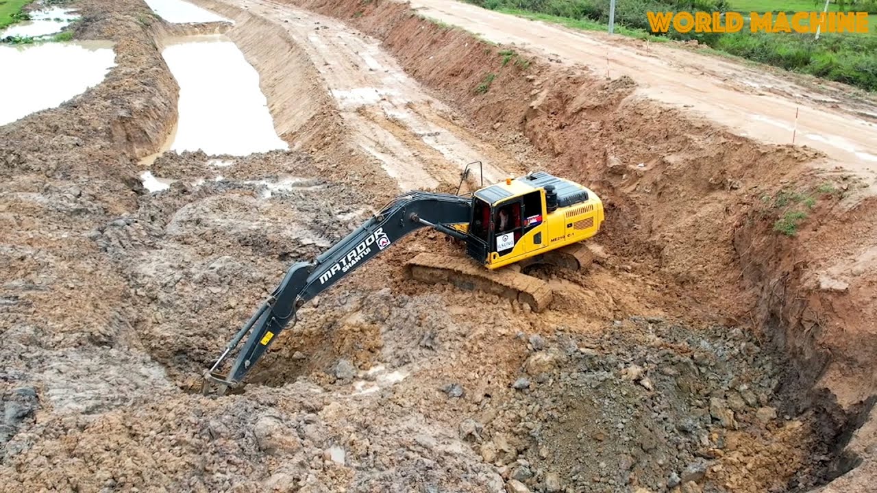New Road Build Process With Caterpillar Excavator Operator Digging Mud ...
