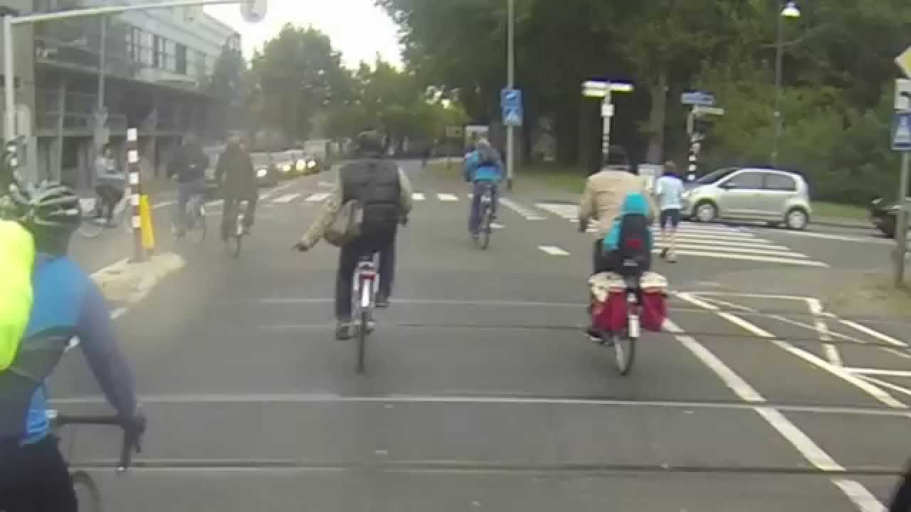 woman cyclist fails to give priority - YouTube