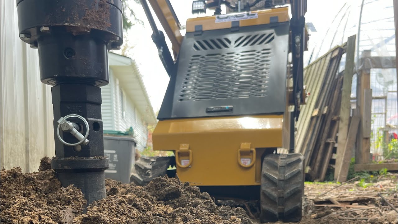 Digging holes, setting posts - YouTube