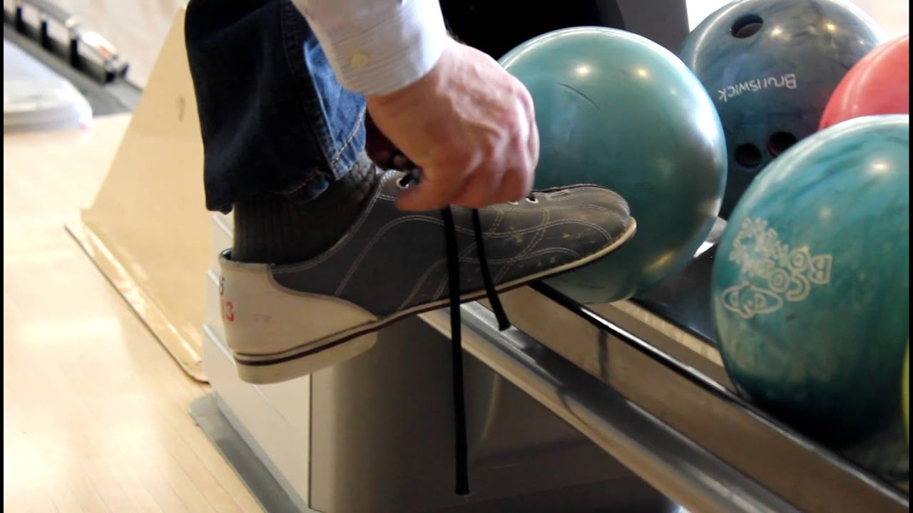 A bowling shoe being tied - YouTube