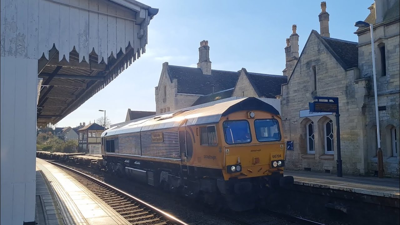 GBRf 66704 'Colchester Power Signalbox' going through Stamford Station ...