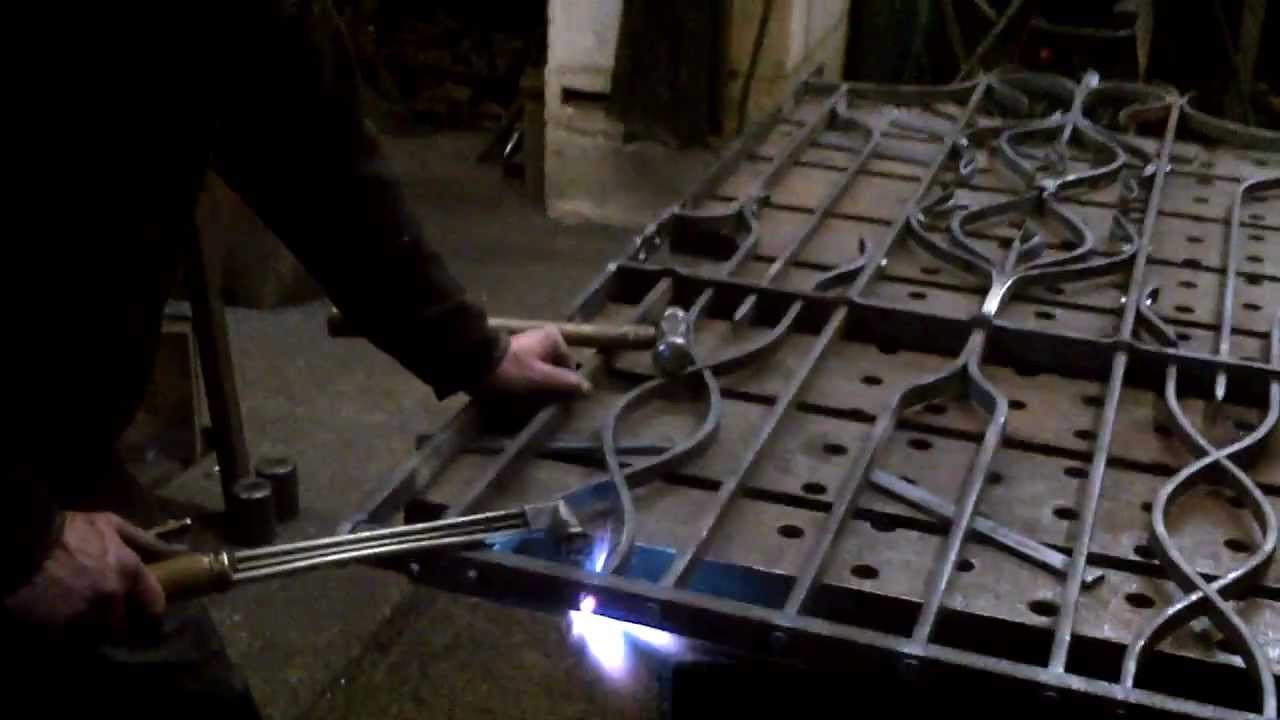 Blacksmith hot riveting a gate. - YouTube