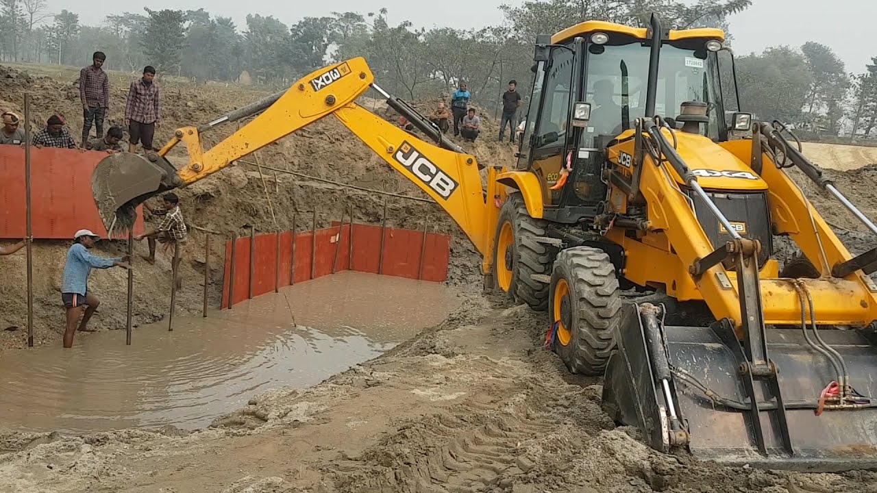 JCB Backhoe Digging and Working For Bridge Foundation Construction ...