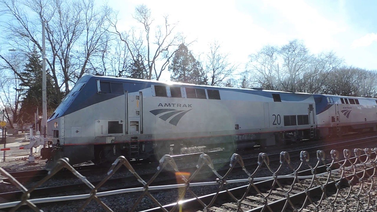 AMTK 20 is the lead engine of 3 of a eastbound amtrak in Naperville IL ...