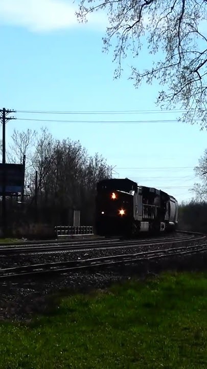 4 engine jet flies over CSX train. - YouTube