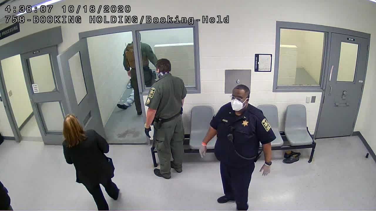 Video shows former detention officer shove inmate into booking cell ...