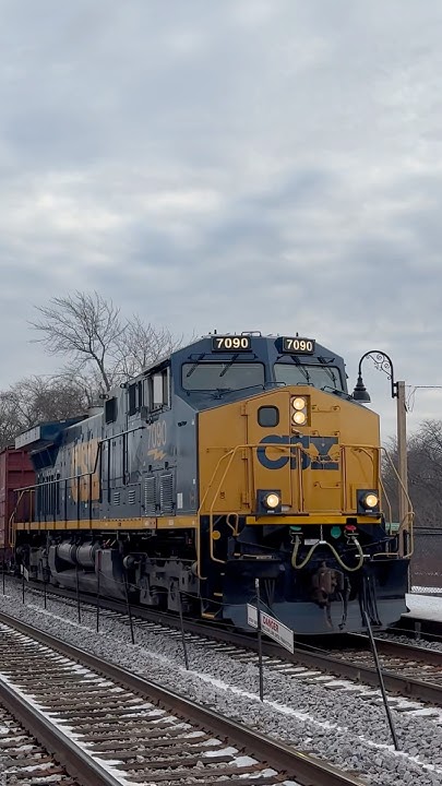 CSX 7090 rolls tanks past Grayland - YouTube