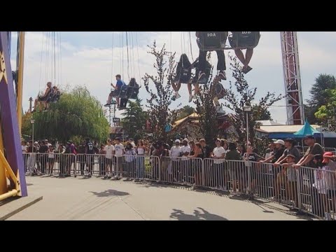 🇨🇦 Playland Amusement Park - Atmosfear sitting in a double swing raised ...