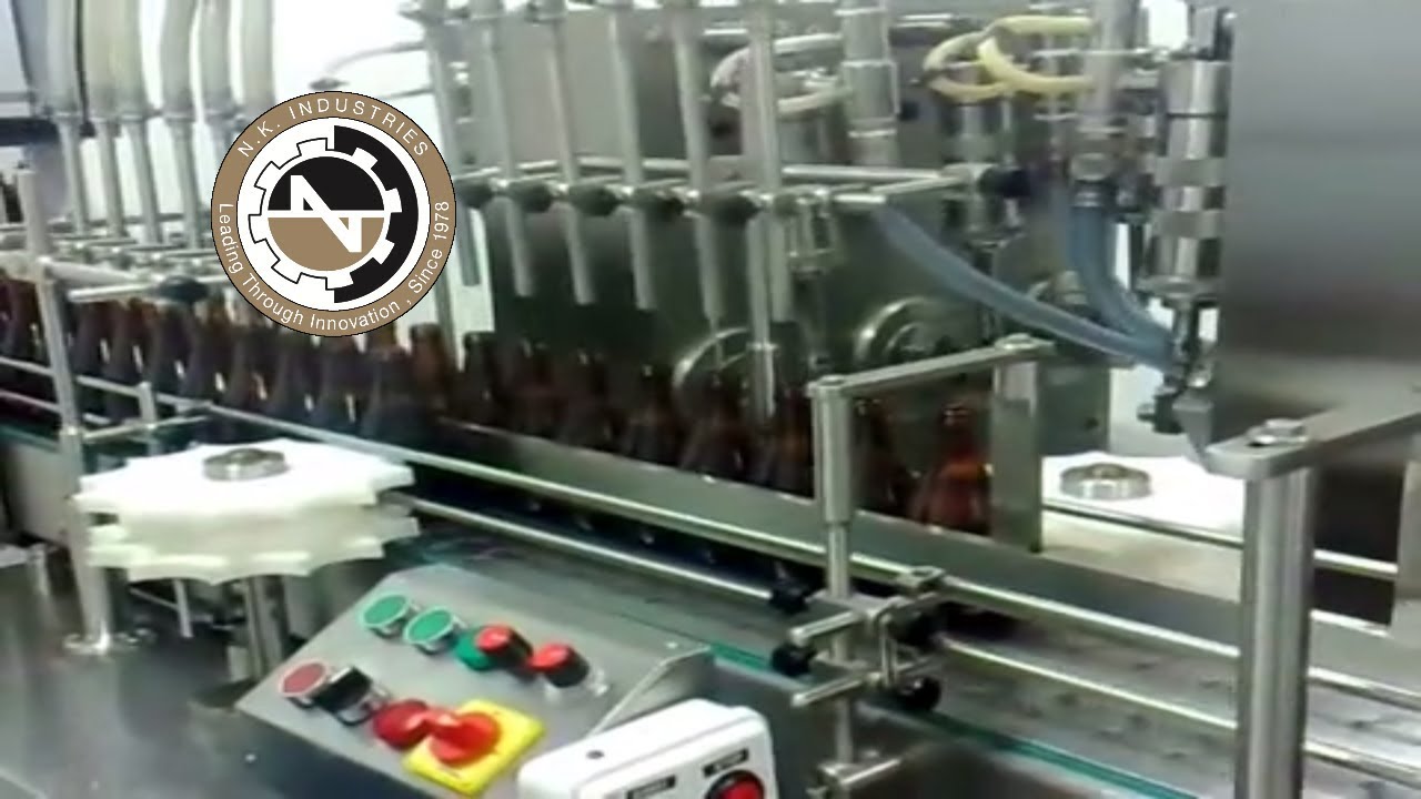 12 head Liquid filling machine by nkindustries - YouTube