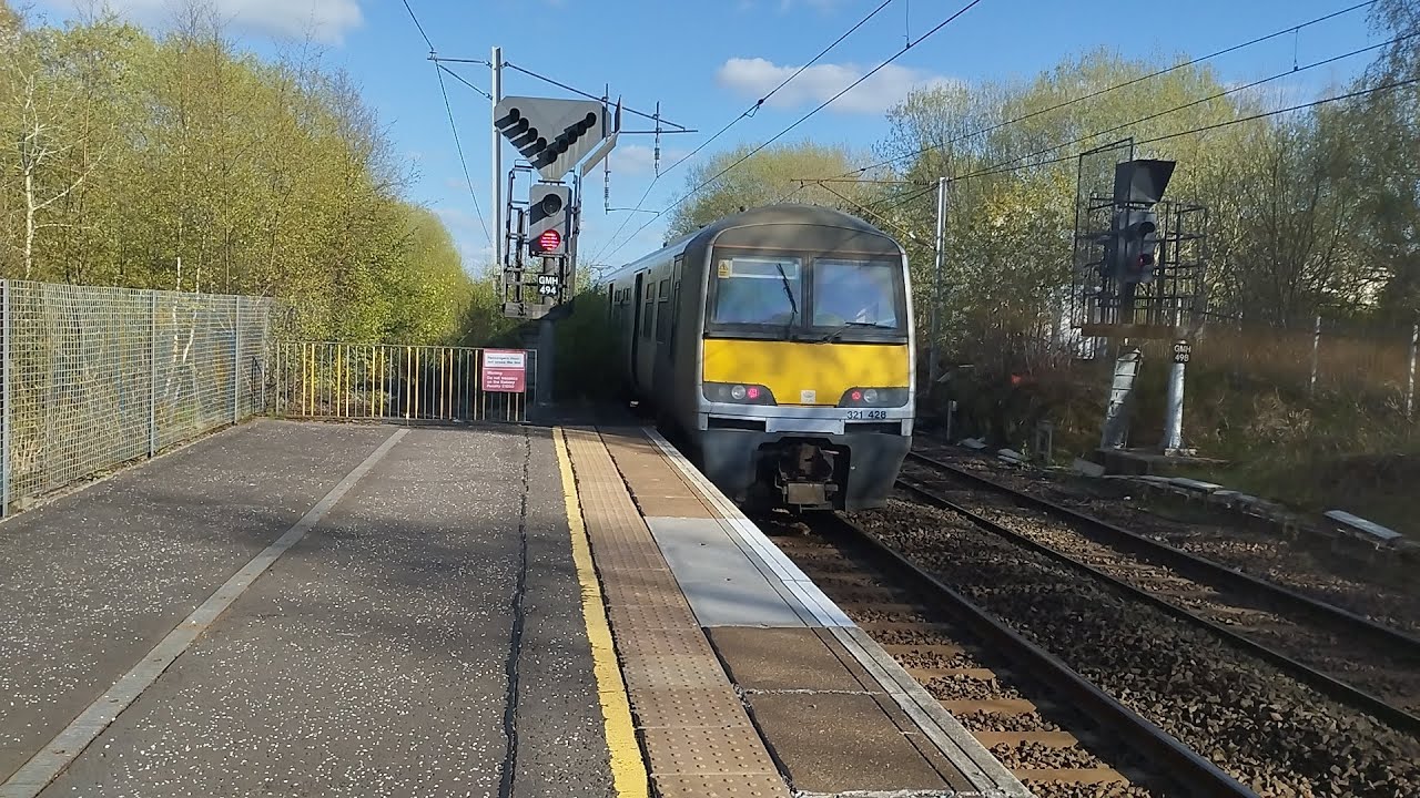 Varamis rail 321407 + 321428 slowly Departing Holytown - YouTube