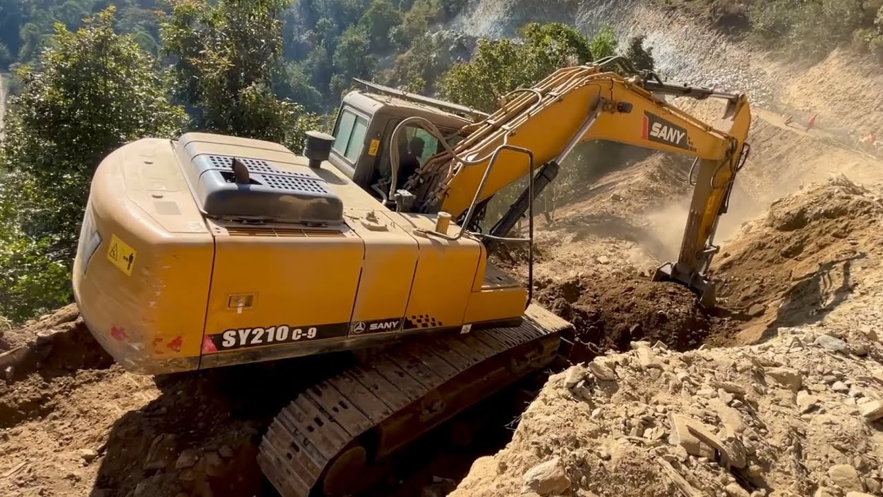 Efficient Excavator Operator Carving a Mountain Road | Sany Excavator ...