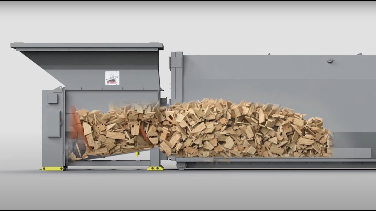 How the Komar Auger-Pak® Shreds and Compacts Wood Pallets - YouTube