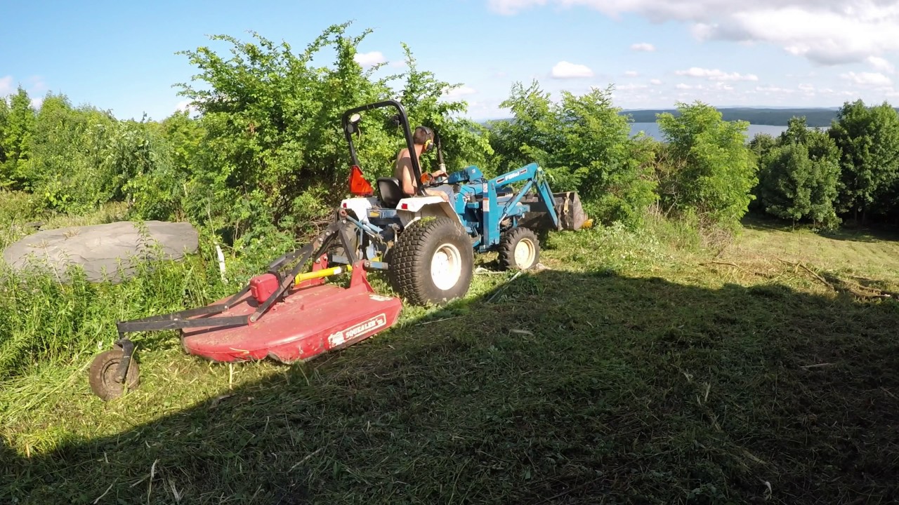 Mowing a hill side - YouTube