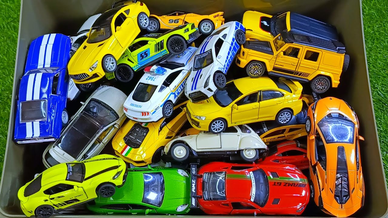 Box full of various miniature cars Peugeot, Volvo, Renault, Hyundai ...