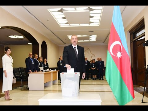 President Ilham Aliyev and family members vote at Polling Station No.6 ...