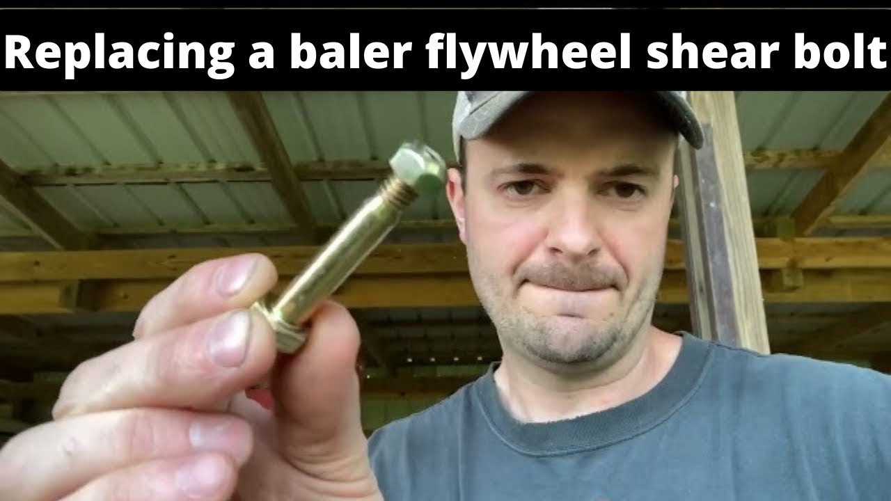 Replacing a flywheel shear bolt on a New Holland baler - YouTube