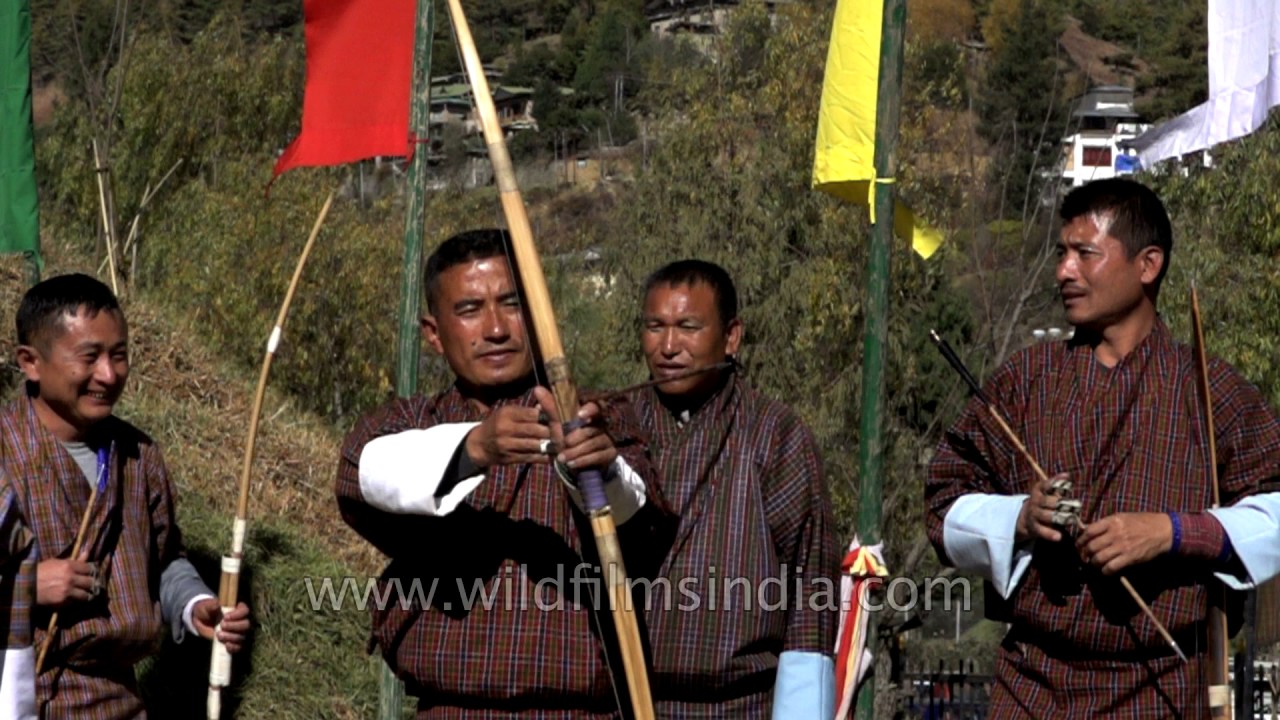 Bhutanese rehearse archery using traditional bamboo bow and arrows ...