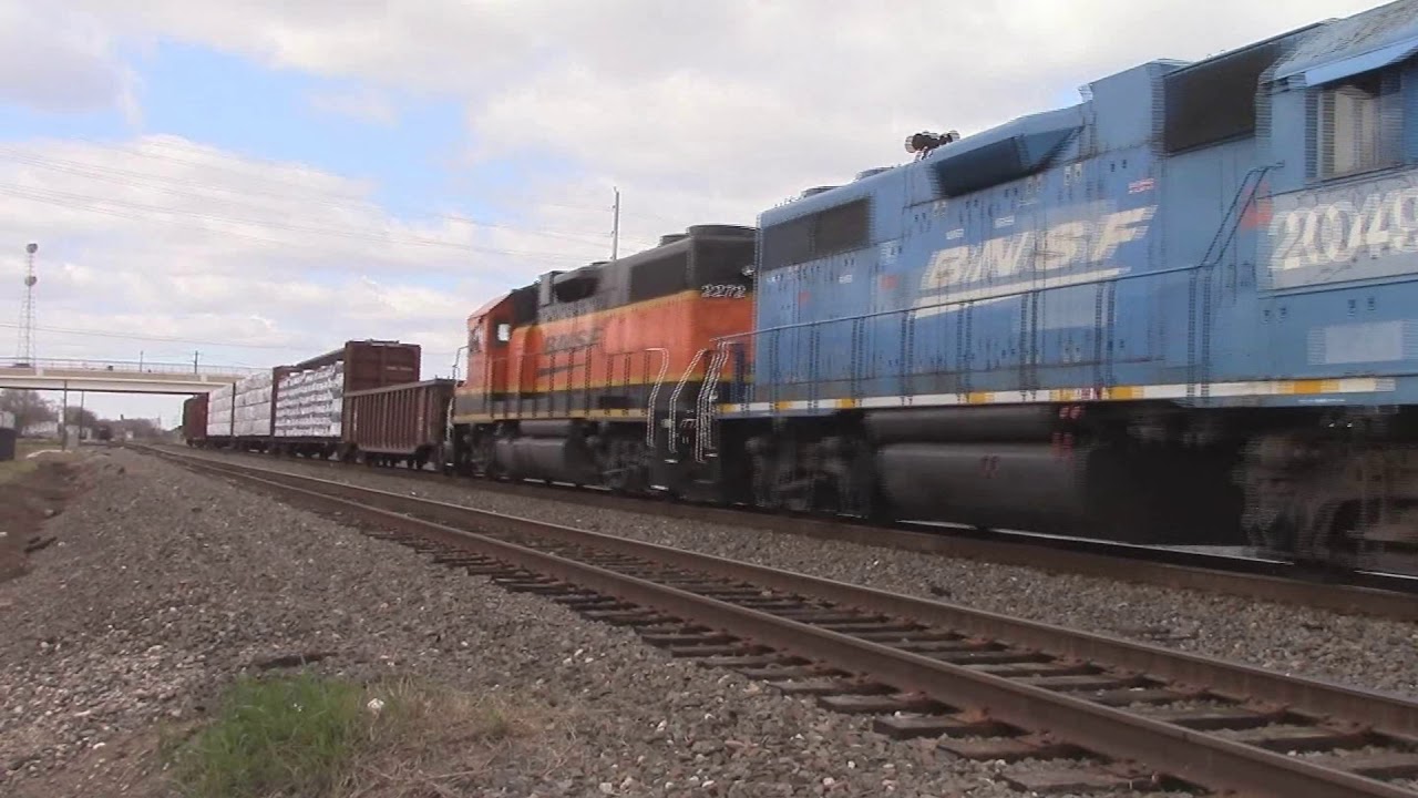 BNSF 2049 (Blue Smurf) leads a local through Rosenberg, TX 12/24/14 ...