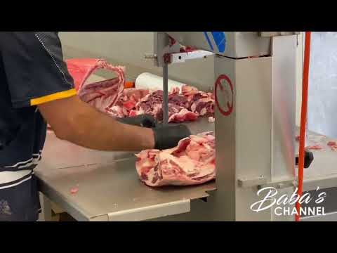 Australian Muslim Butcher cutting Fresh Qurban GOAT into pieces