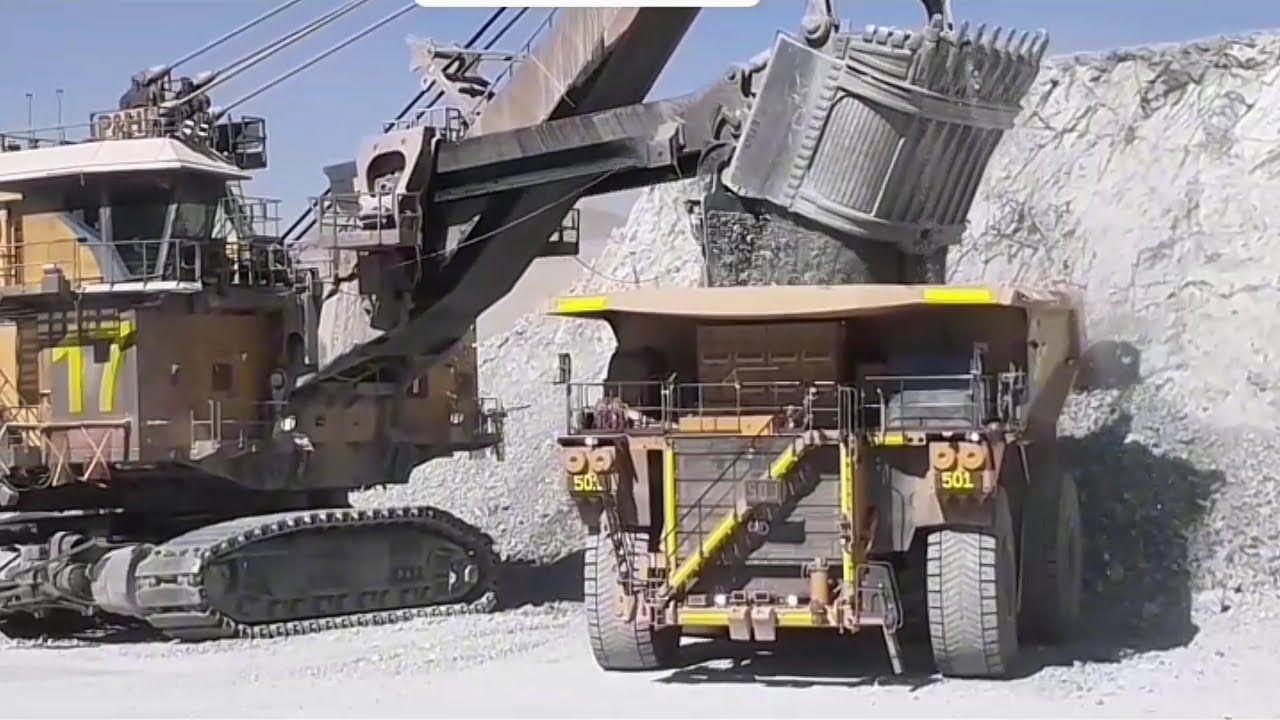 Loading Large Scale CAT 798AC and Komatsu 980E Extraction Trucks - YouTube