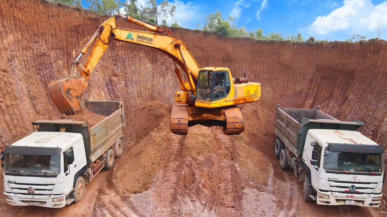 Excavator Loading Dump Trucks with Two Passes Working on Hillside, JCB ...