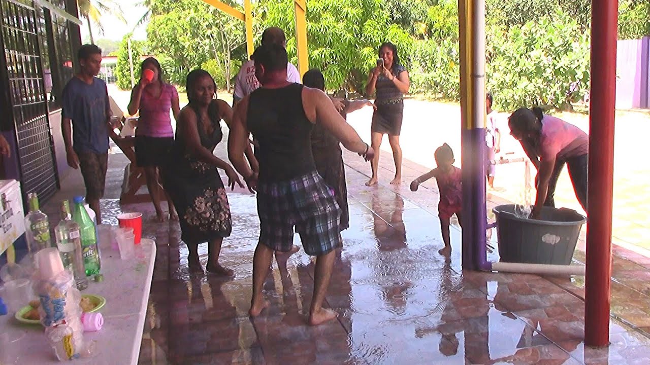Playing Holi / Phagwah in Guyana on the West Coast Demerara at New Road ...