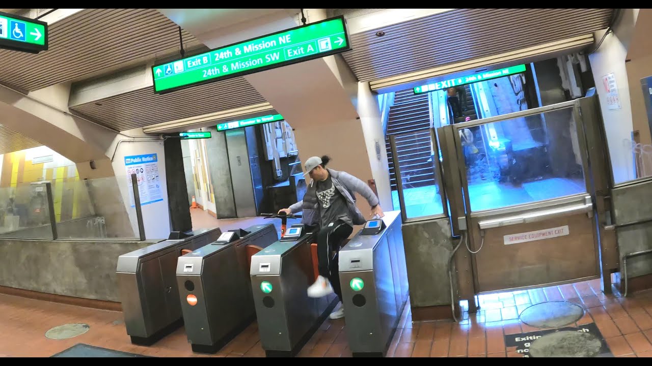 E-scooter rider jumps gate rides a scooter in Bart Station nearly hits ...