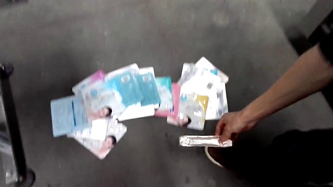 Manufacture facial sheet mask packing machine for skin care - YouTube