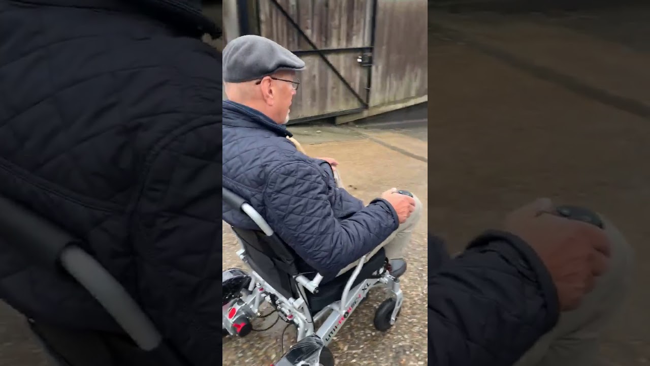 Using an electric folding wheelchair in the rain (LITH TECH SMART CHAIR ...