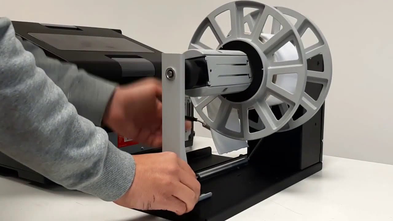 CW-C6500A Roll to Roll Label System - YouTube