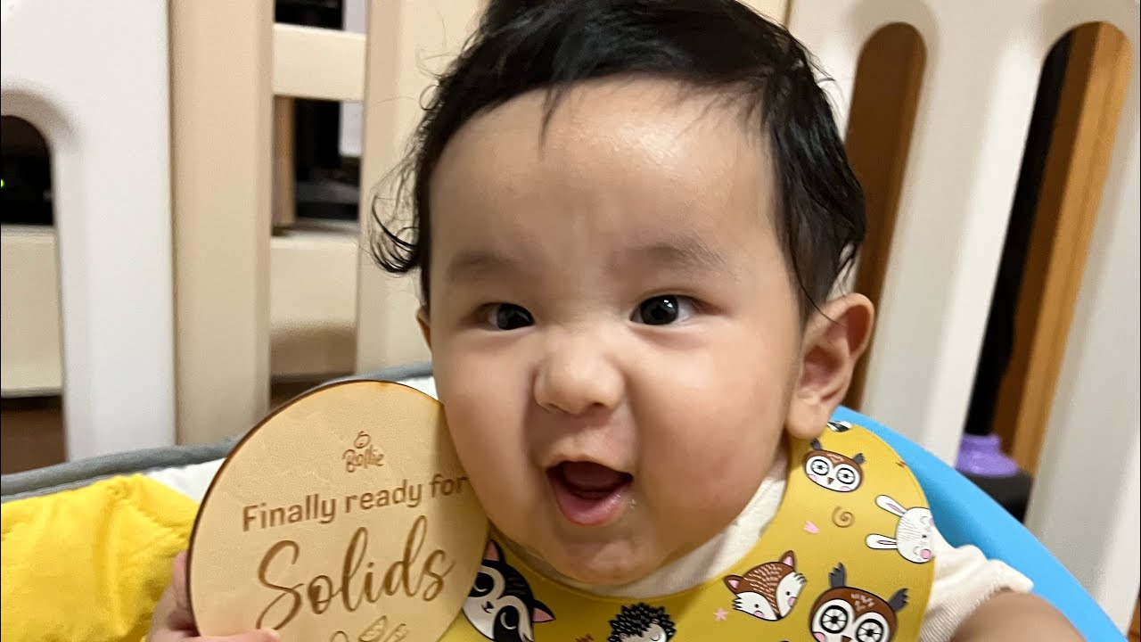 1st solid food - YouTube