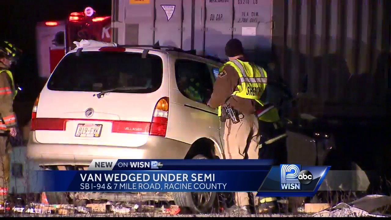 Van becomes wedged under semi on I-94 - YouTube