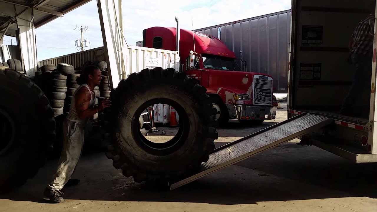 Unloading big tires - YouTube