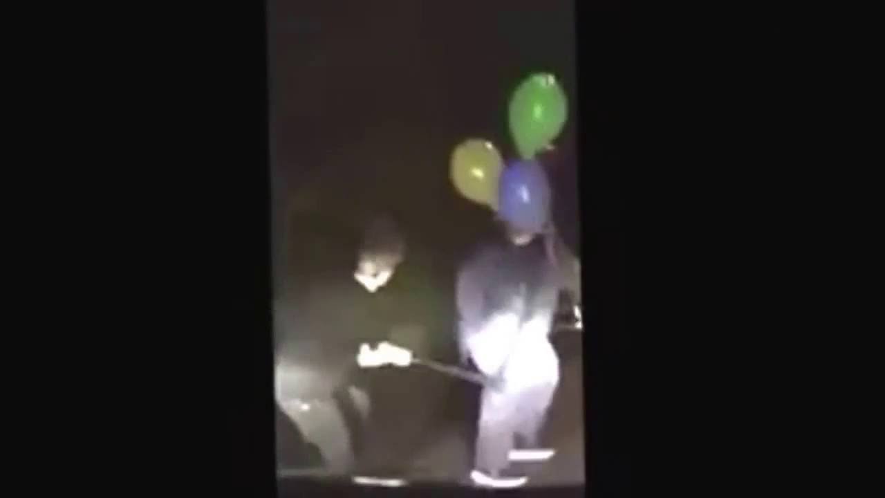 Clown on road gets beaten by two guys - YouTube