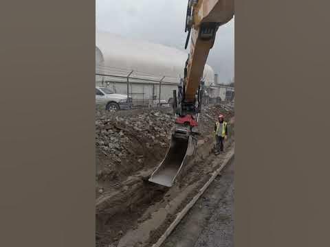 Liebherr with Dump Trailer Digging Trench for Electrical Conduit - YouTube
