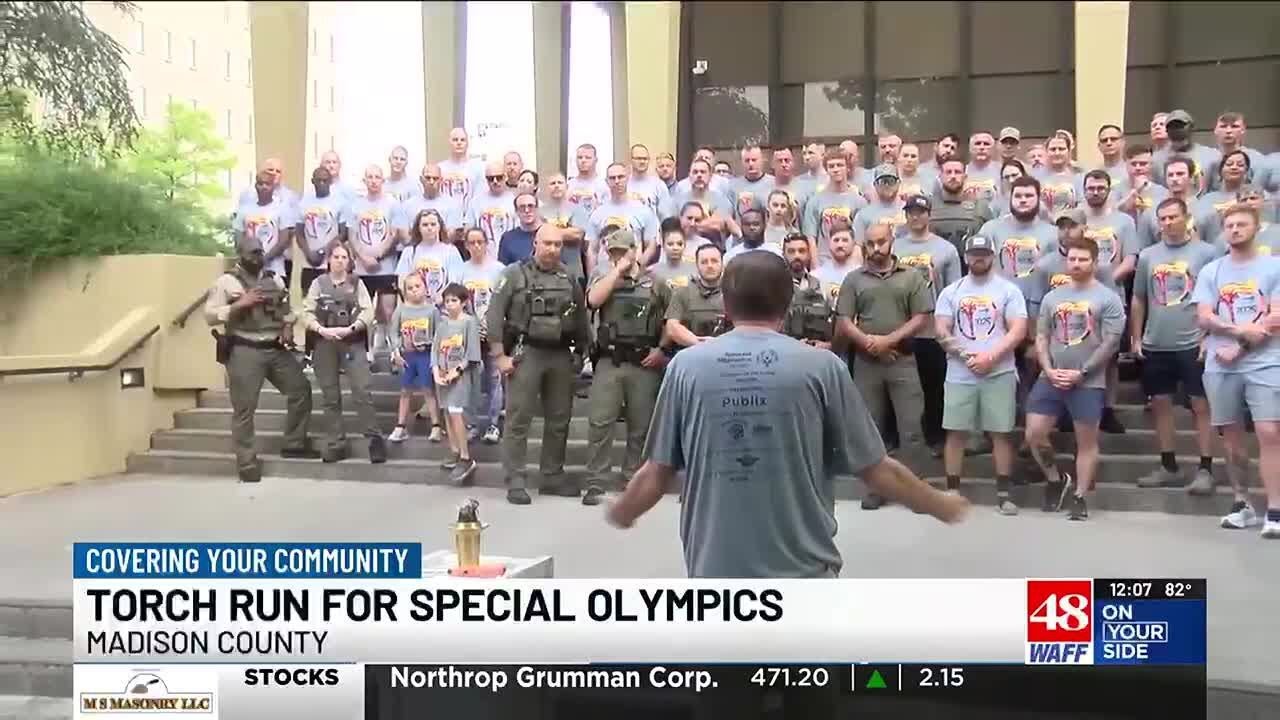 Law enforcement officers take part in Torch Run for Special Olympics ...
