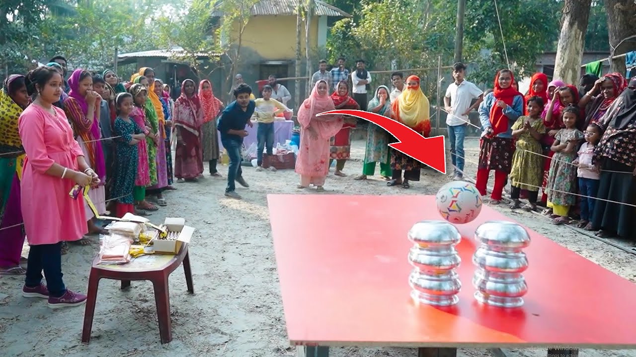 The game of breaking bottles with football. It is difficult to know who ...